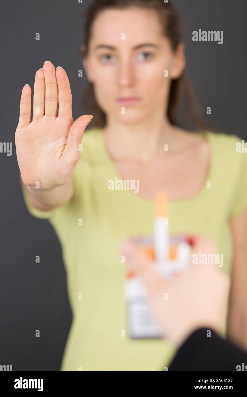 Woman with cigarette packet hi-res stock photography and images - Alamy