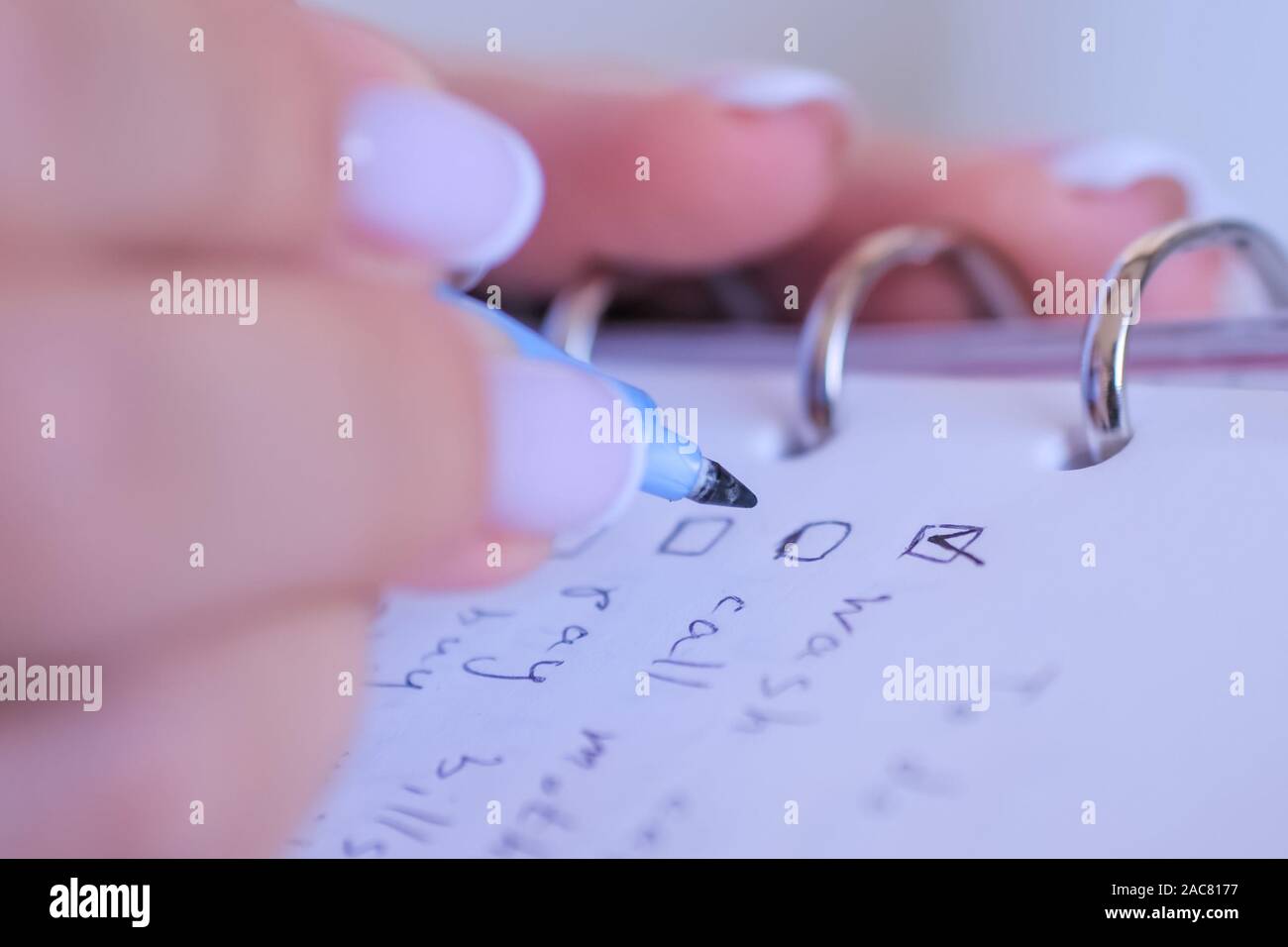 Hand putting check mark hi-res stock photography and images - Alamy