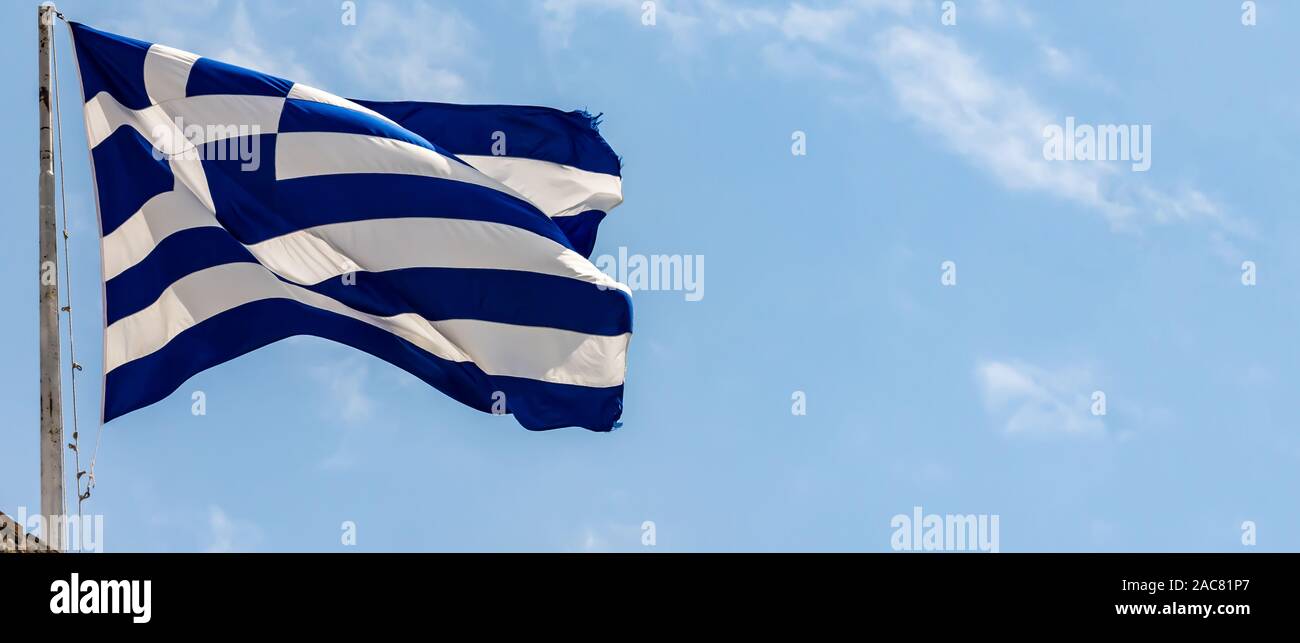 Greek national flag waving on blue sky background. Hellenic Republic ...