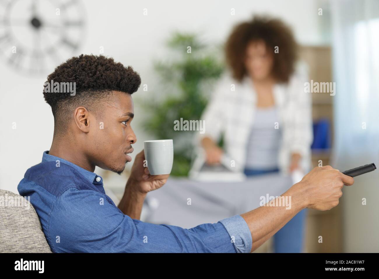 man watching tv Stock Photo - Alamy