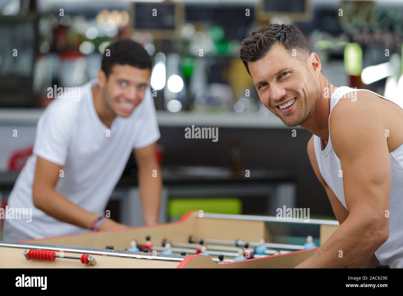 people are playing table football Stock Photo - Alamy