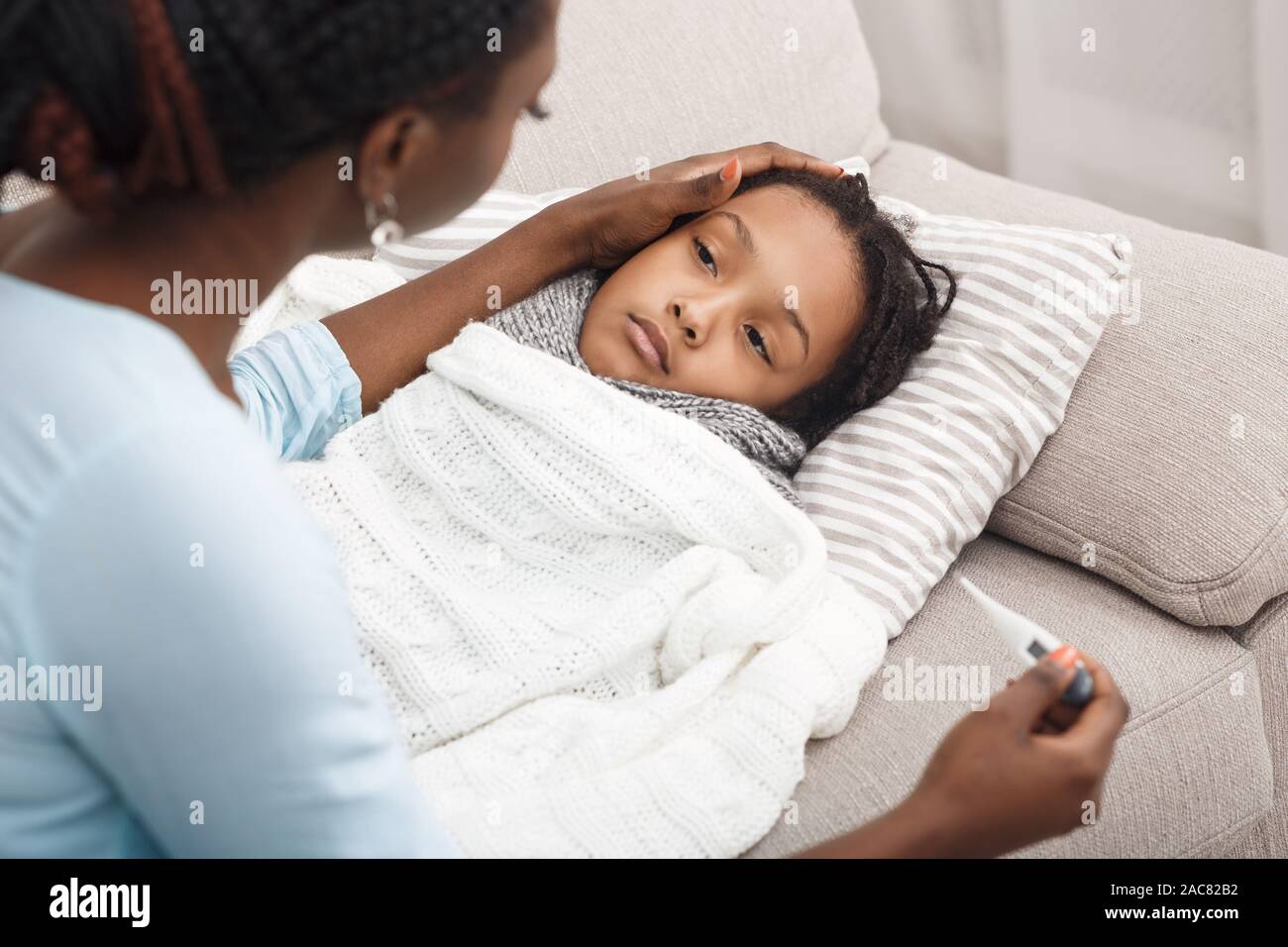 Daughter caring sick mother cold hi-res stock photography and images ...