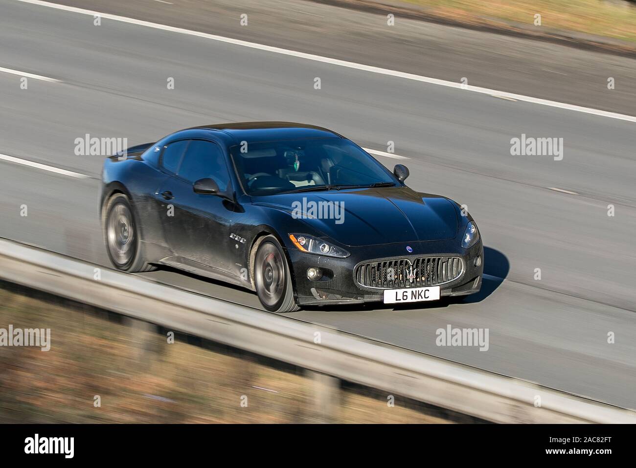 Blurred moving car L6NKC Maserati Granturismo S Semi-Auto traveling at ...