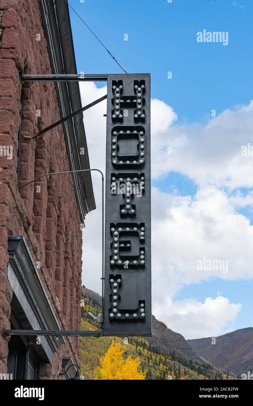 Old vertical hotel sign on the outside of building Stock Photo - Alamy