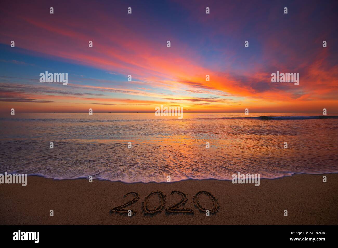 Happy New Year 2020 concept, lettering on the beach. Sea sunrise Stock ...