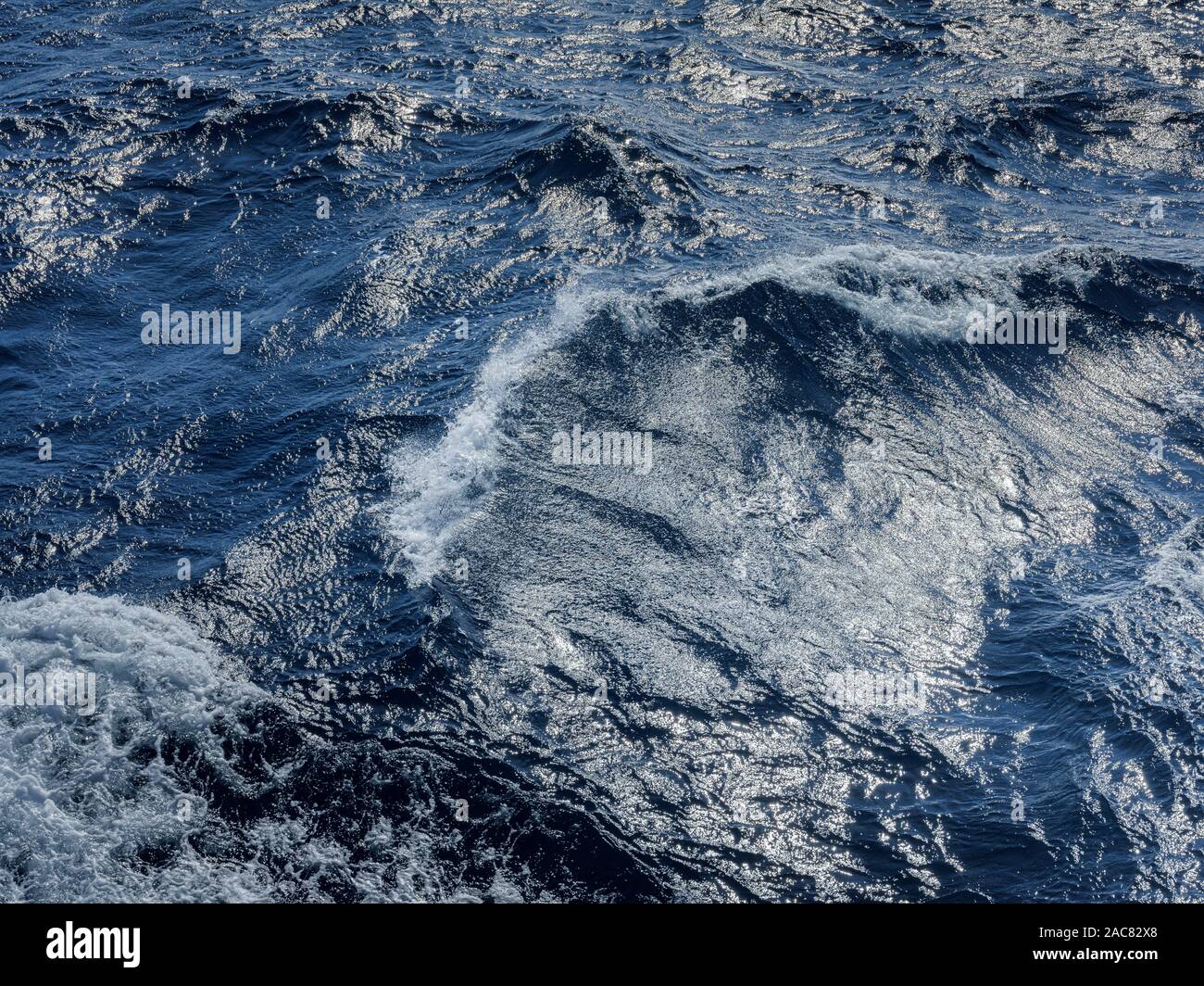 Rough deep turquoise and blue South China Sea with white foam texture ...