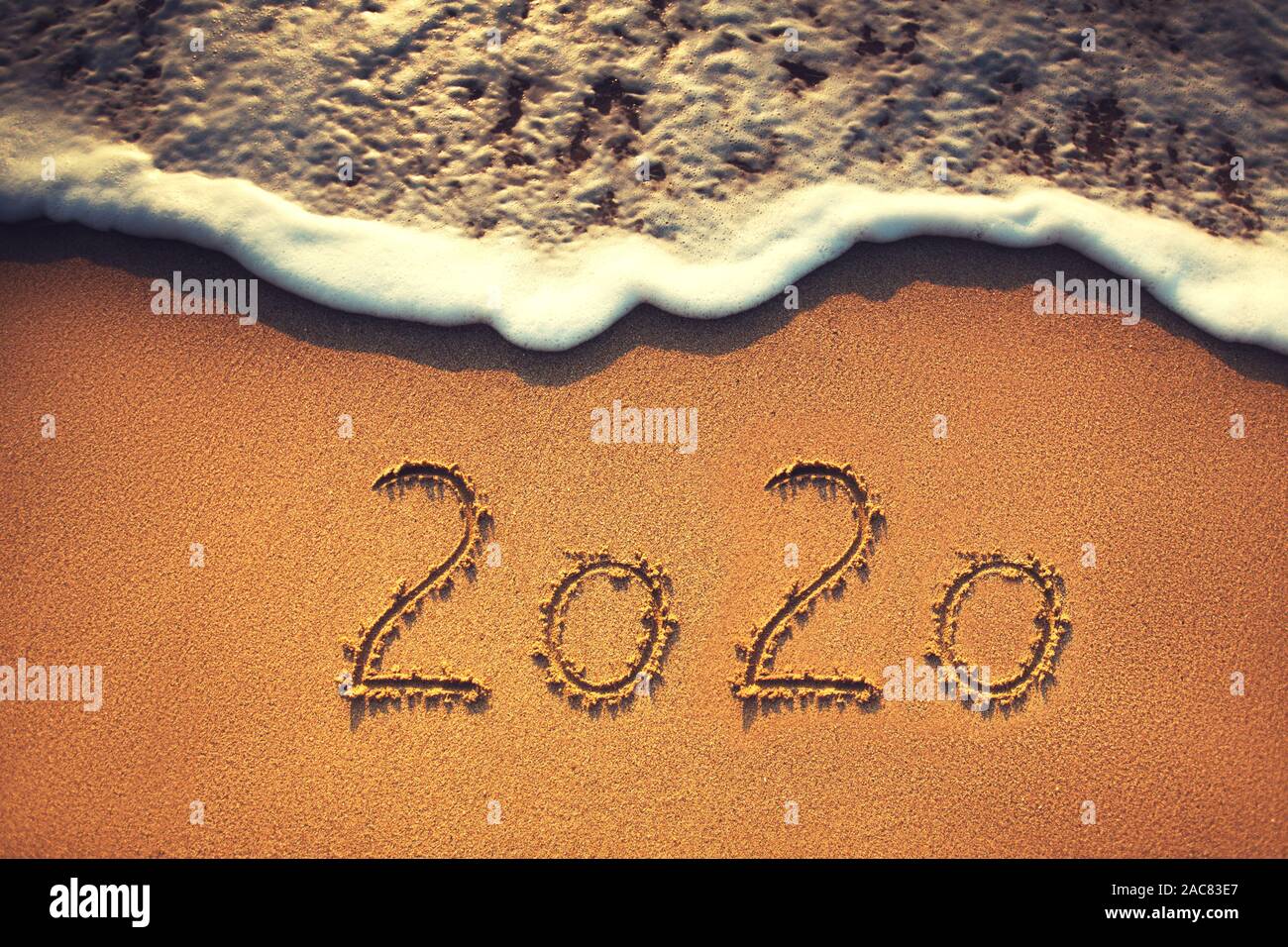 Happy New Year 2020 concept, lettering on the beach. Sea sunrise Stock ...