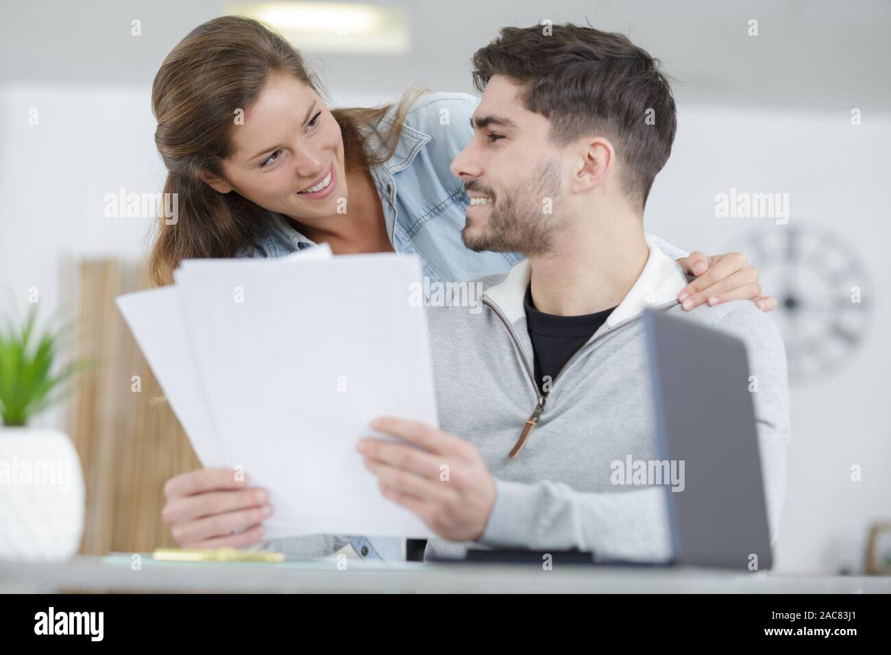 young husband and wife doing paperwork together Stock Photo - Alamy