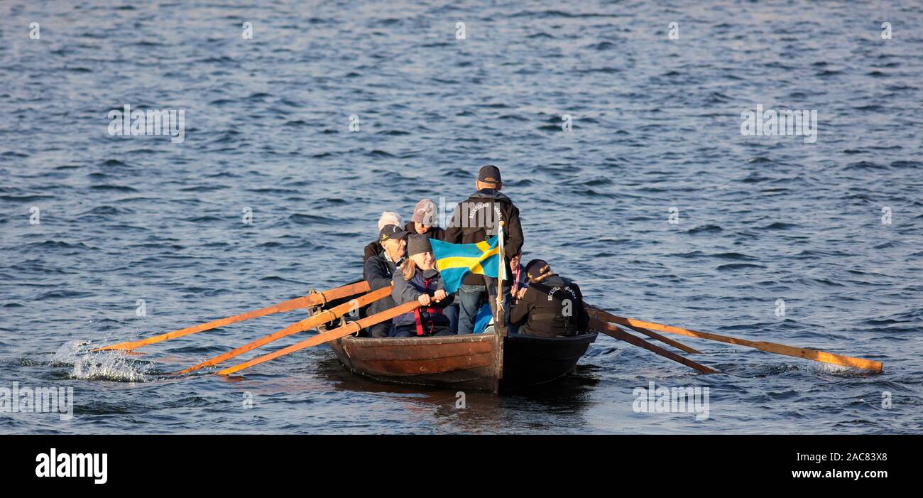 A team of people rowing an old rowing boat in Stockholm, Sweden Stock ...