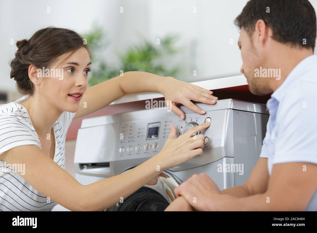 Woman washing machine defect hi-res stock photography and images - Alamy