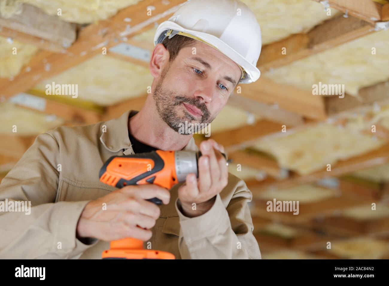 Two man drilling hi-res stock photography and images - Alamy