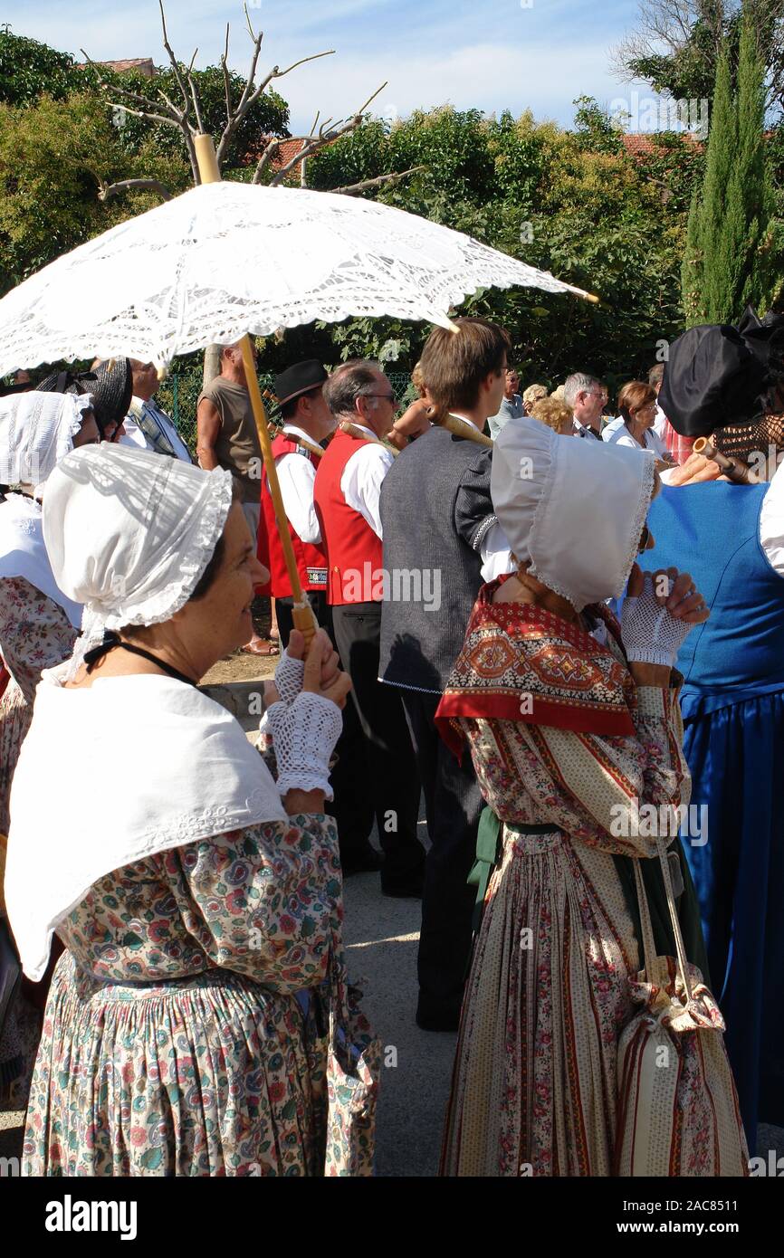 Women in traditional Provencal dress for the olive tree festival in ...