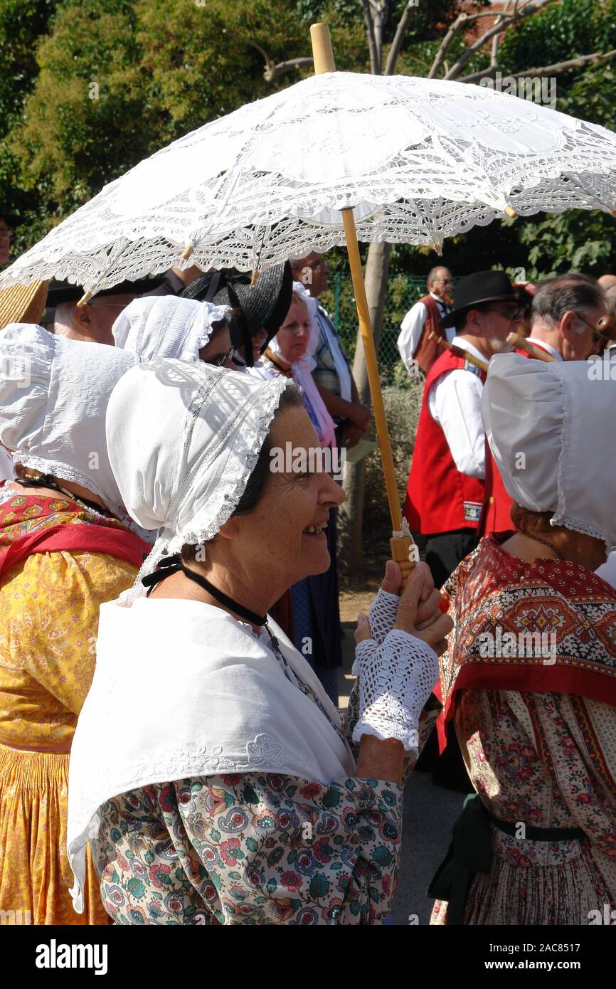 Women in traditional Provencal dress for the olive tree festival in ...