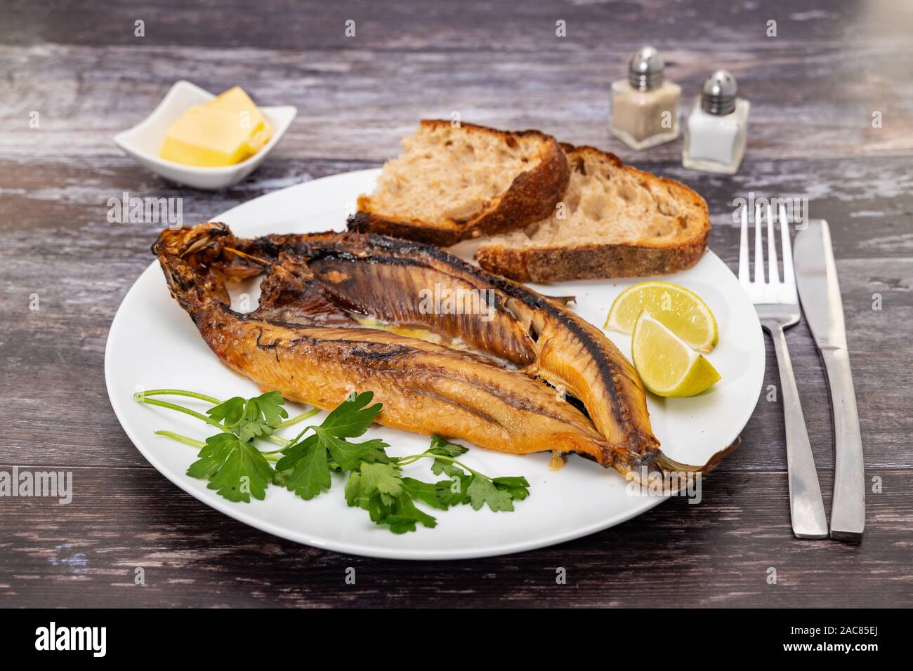 Kipper breakfast with crusty bread and butter Stock Photo - Alamy