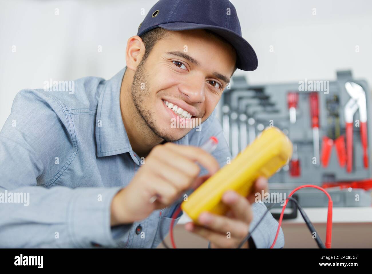 a male electrician is measuring voltage Stock Photo - Alamy