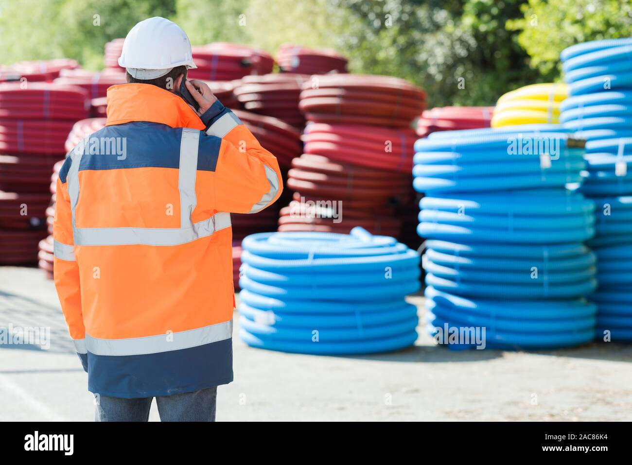 highway construction worker and heavy equipment Stock Photo - Alamy
