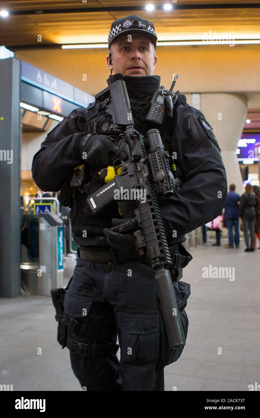 Armed police patrol London Bridge train station with an AR-15 semi ...