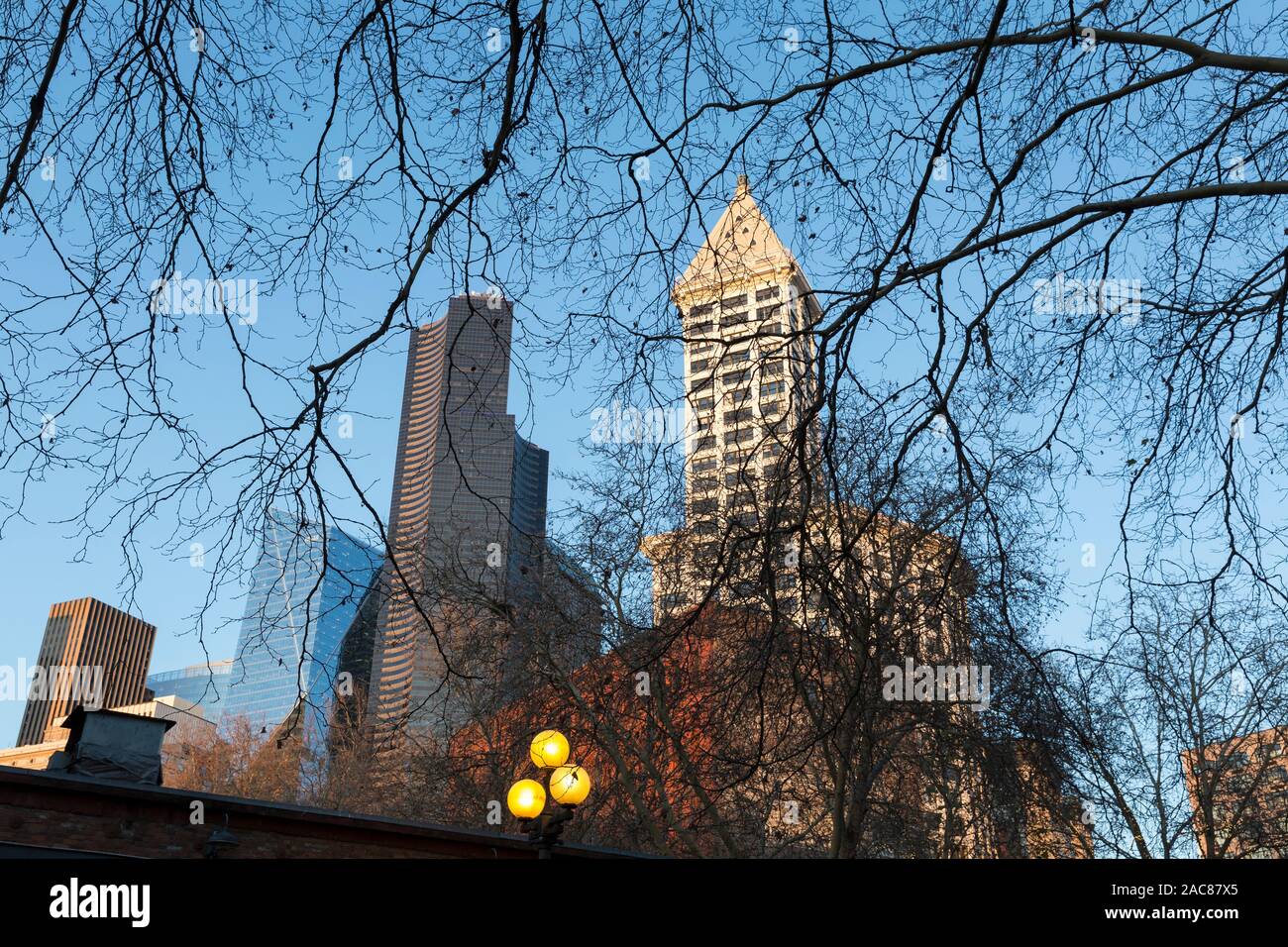 Sunset illuminates several of Seattle’s tallest buildings through a ...