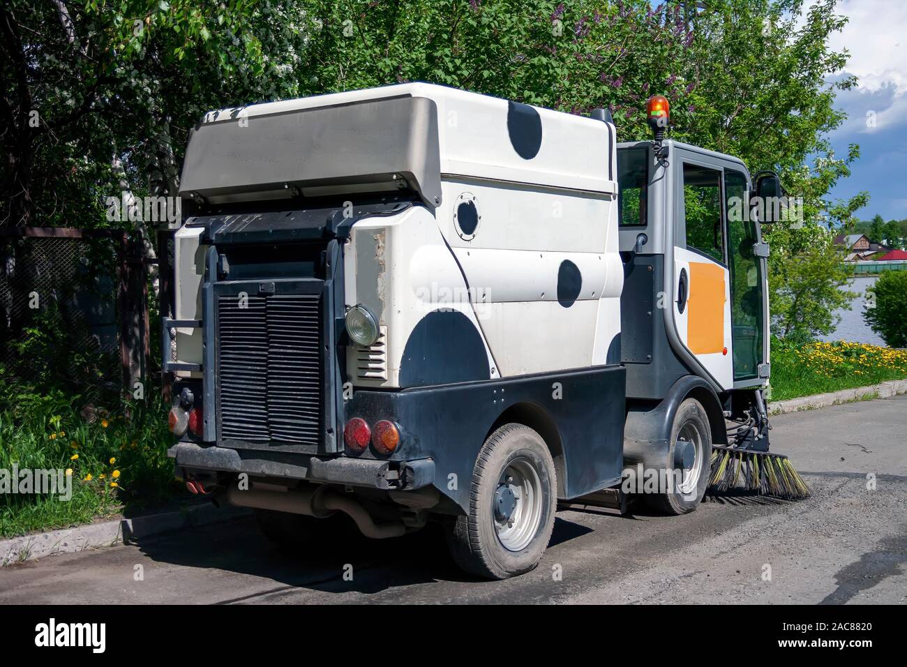 Machine sweeper - cleaner cleans the roadway. Machine brushes sweeping ...