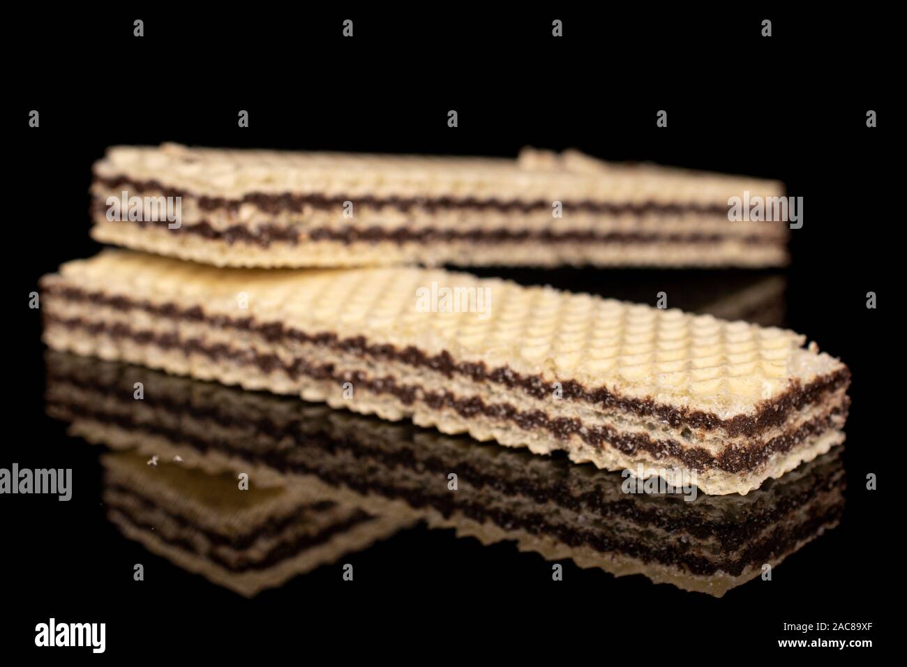 Group of two whole sweet chocolate biscuit wafer isolated on black ...