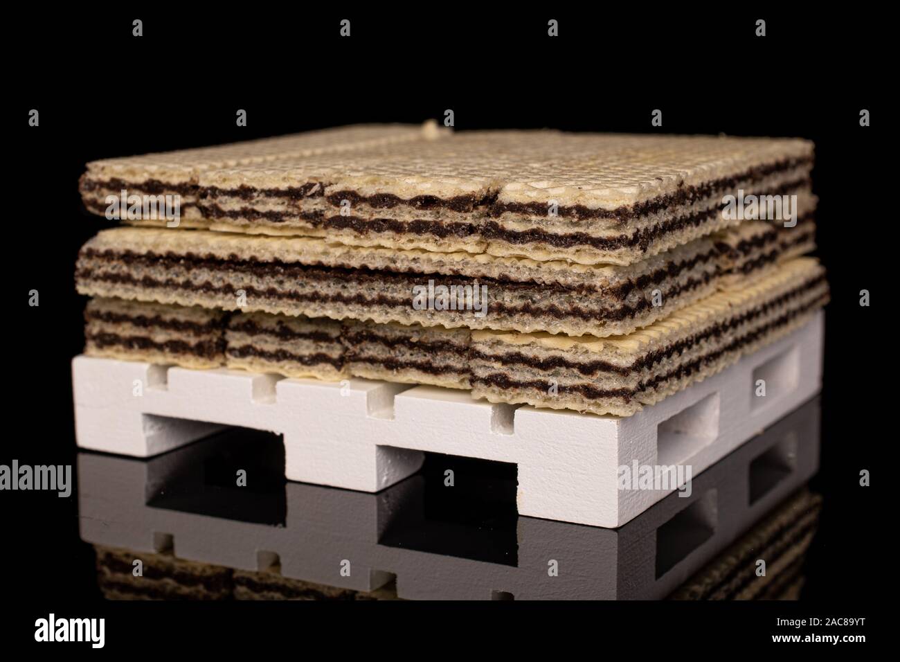 Lot of whole sweet chocolate biscuit wafer on white pallet isolated on ...