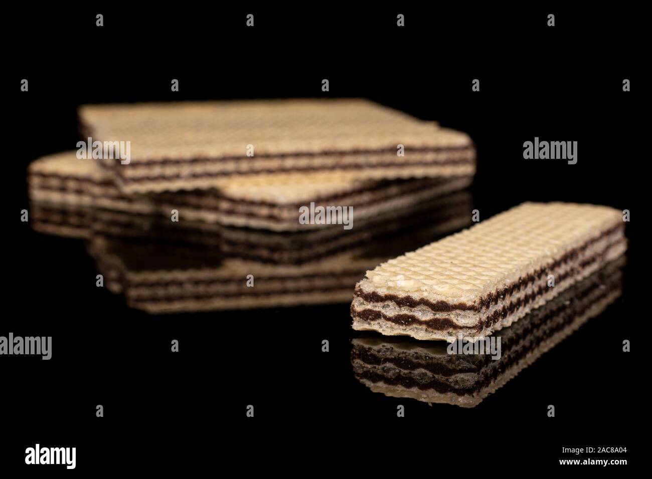 Lot of whole crispy sweet chocolate biscuit wafer isolated on black ...