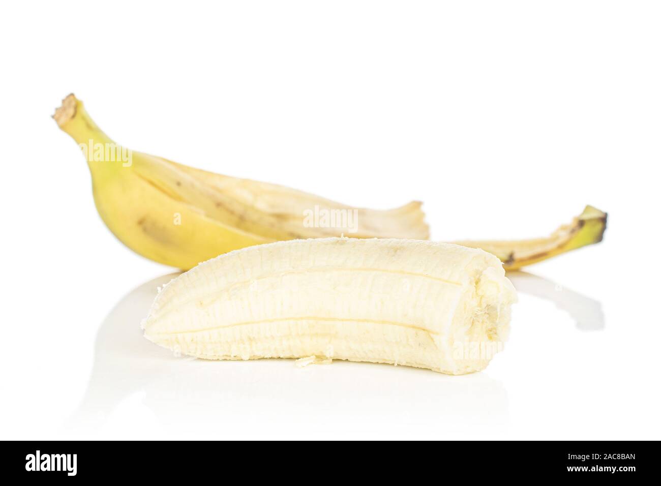 Group of one half one piece of peeled sweet yellow banana isolated on ...