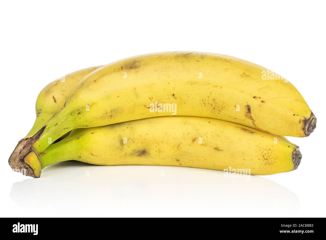 Group of three whole sweet yellow banana isolated on white background ...