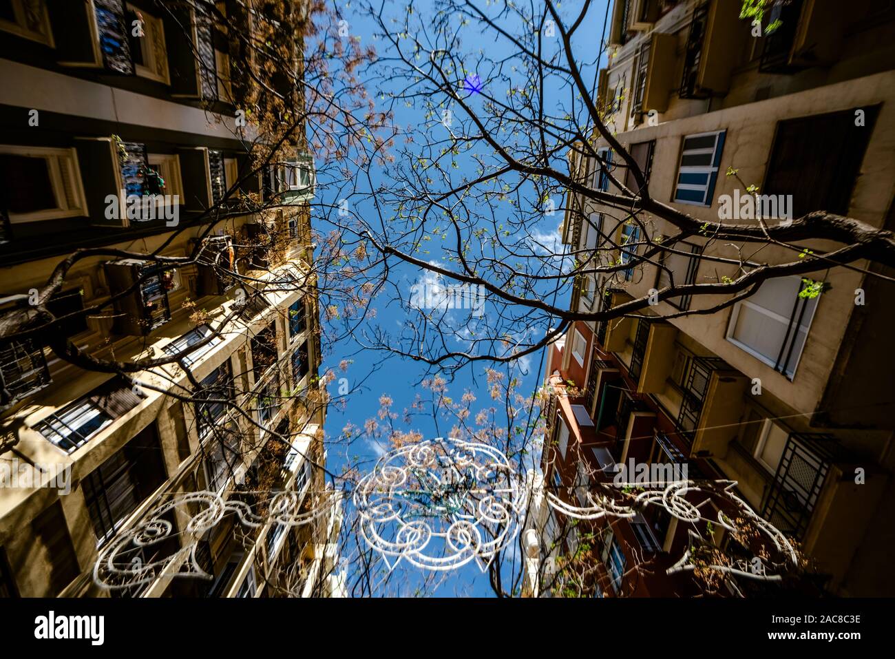 Symmetrical view of the facades of a street with old buildings in good ...