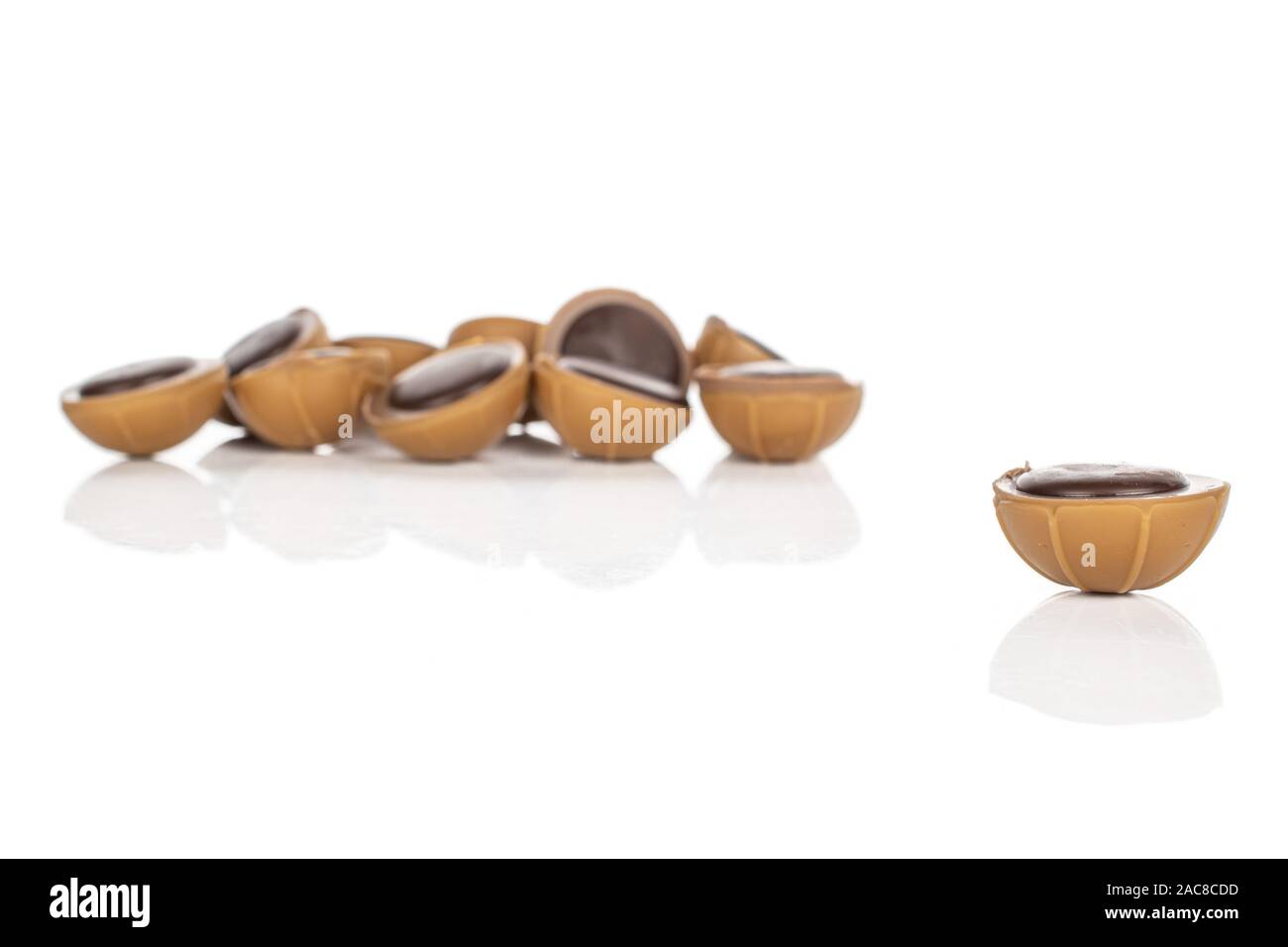 Lot of whole sweet brown toffee candy isolated on white background ...