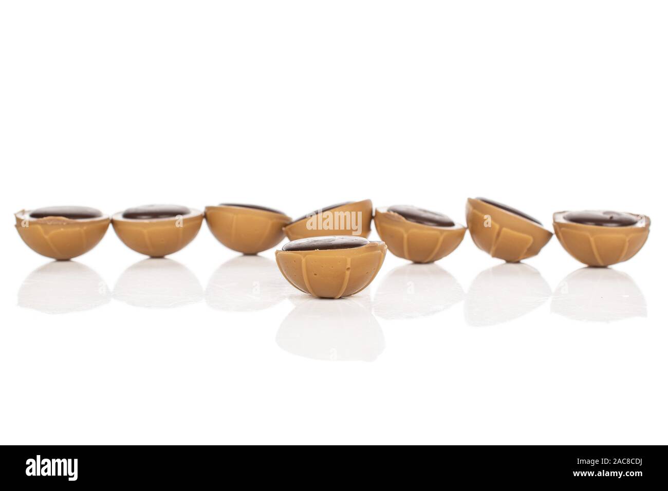 Group of eight whole sweet brown toffee isolated on white background ...