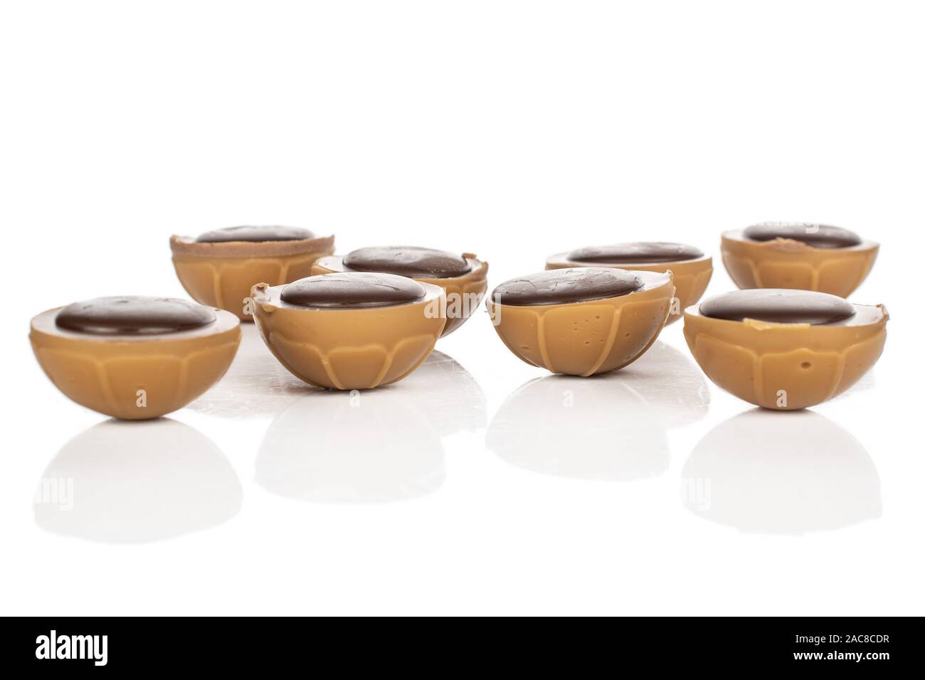 Group of eight whole sweet brown toffee isolated on white background ...