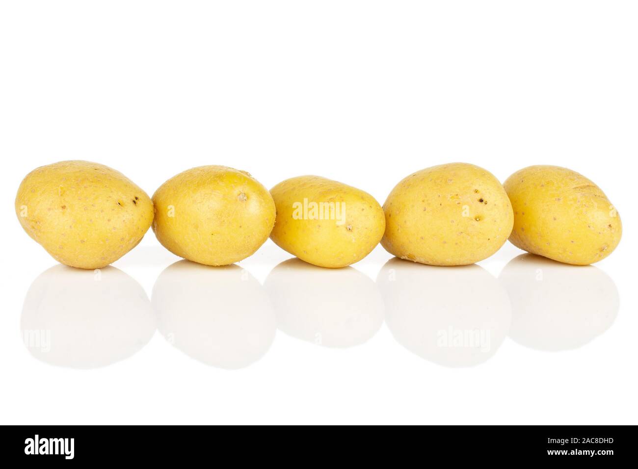 Group of five whole pale yellow potato isolated on white background ...