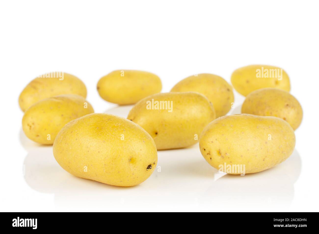 Lot of whole pale yellow potato isolated on white background Stock ...