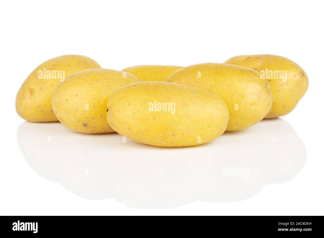 Group of six whole pale yellow potato isolated on white background ...