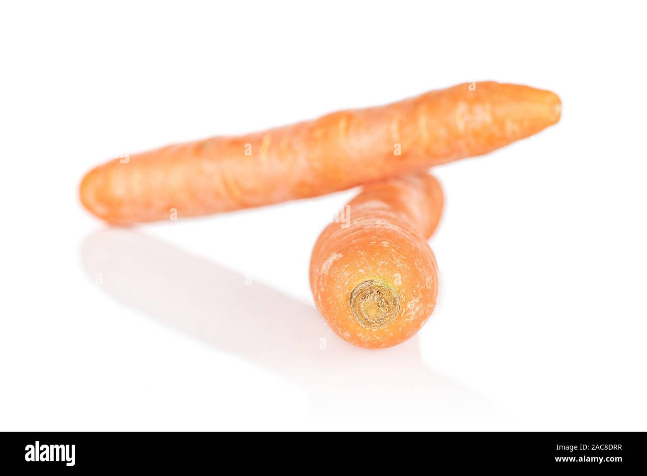 Group of two whole crossed fresh orange carrot isolated on white ...