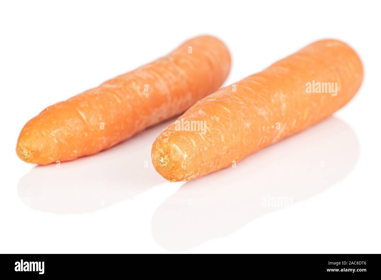 Group of two whole fresh orange carrot isolated on white background ...