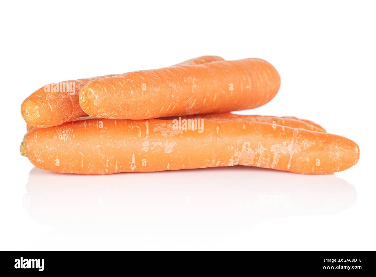 Group of four whole fresh orange carrot isolated on white background ...