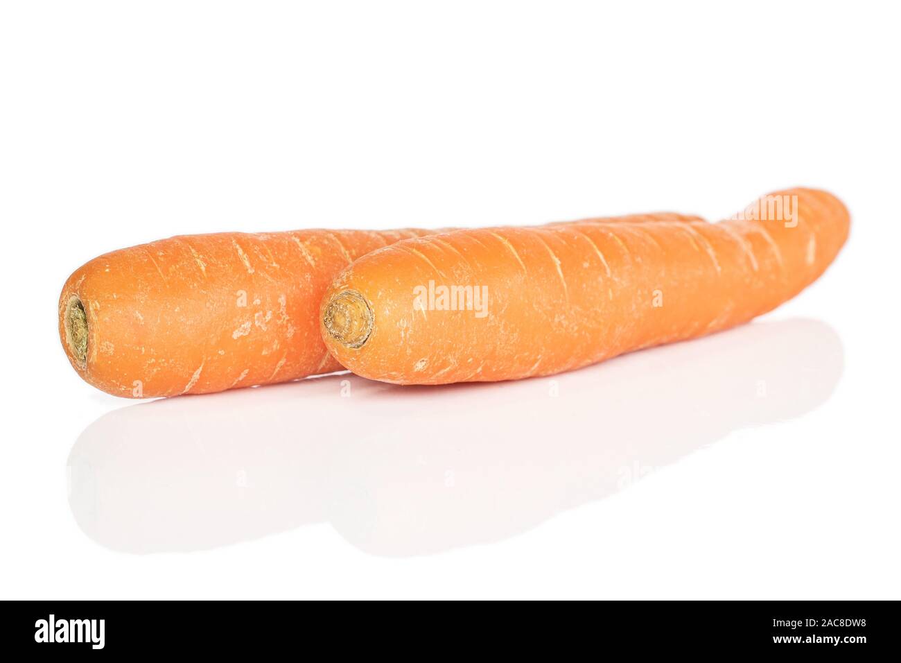 Group of two whole arranged fresh orange carrot isolated on white ...