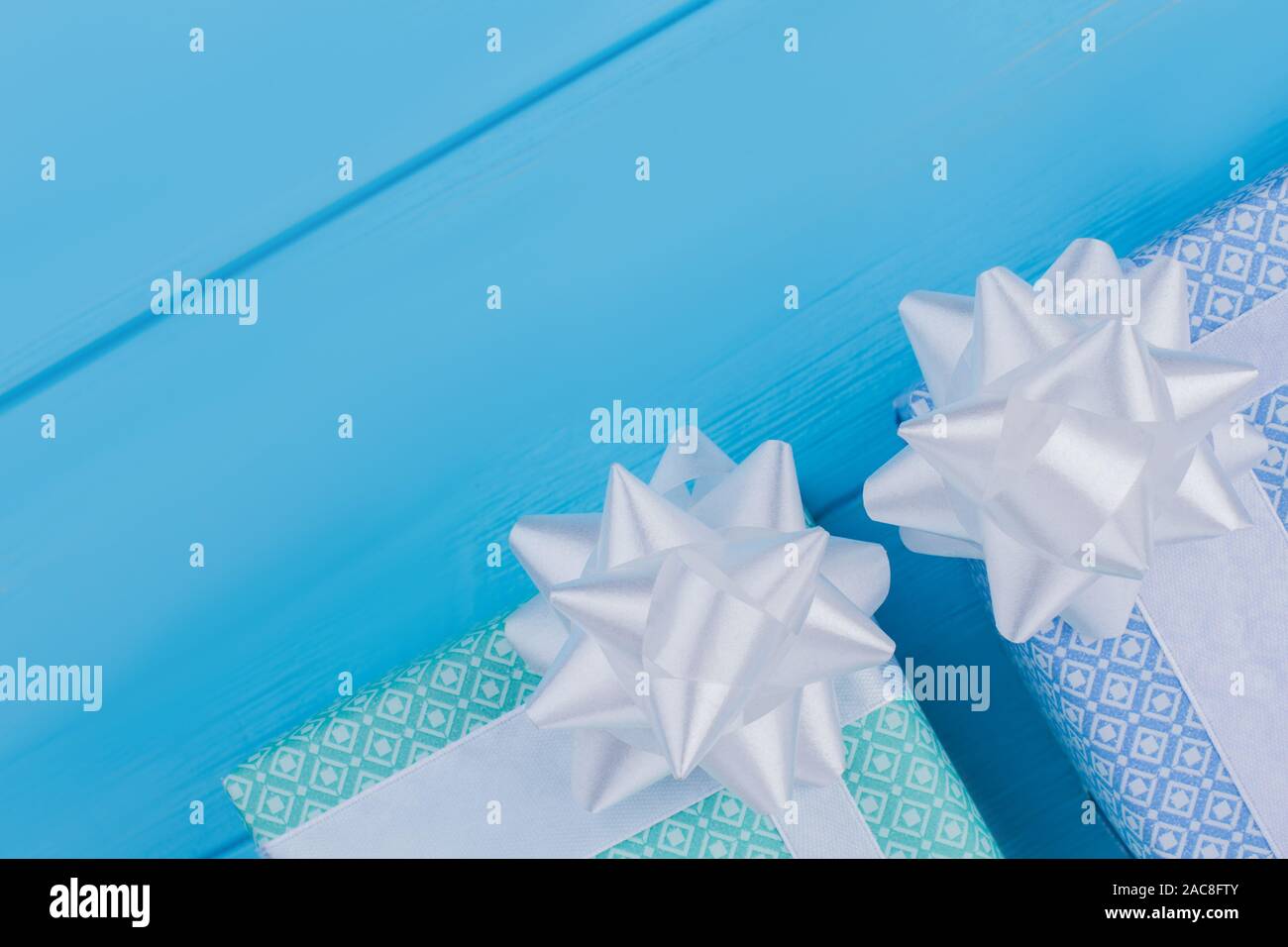 Decorative gift boxes with bow wrapped in patterned paper Stock Photo ...