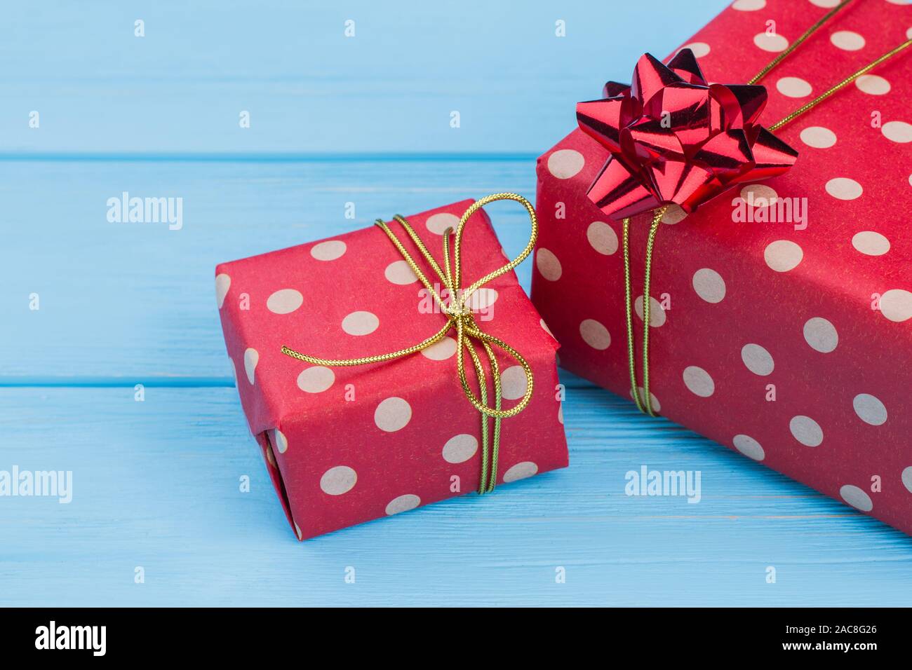 Big and little red dotted gift boxes Stock Photo - Alamy