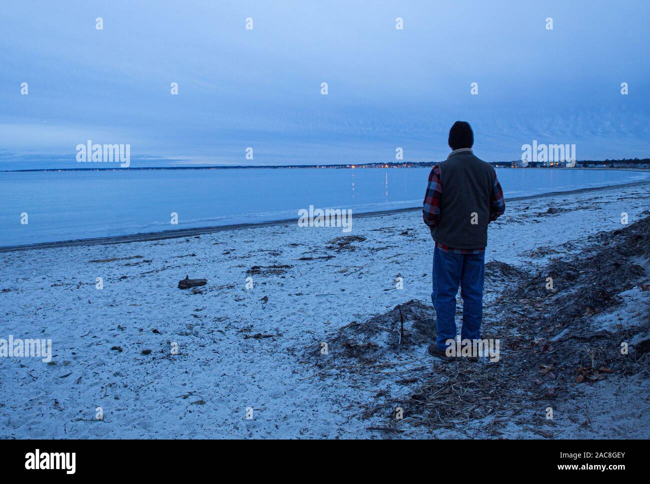 Man looking out into the ocean hi-res stock photography and images - Alamy