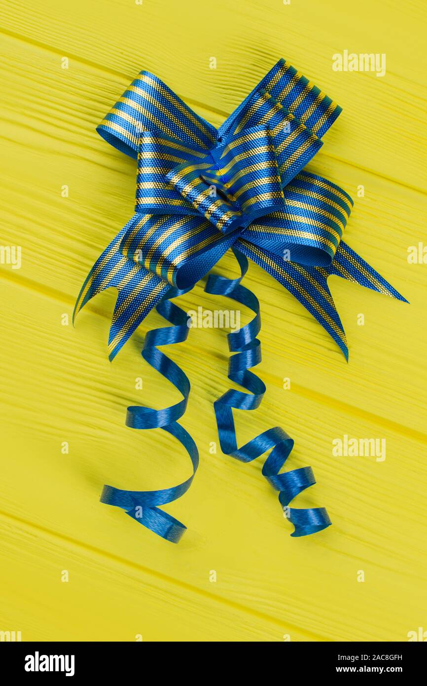 Blue striped bow for presents Stock Photo - Alamy