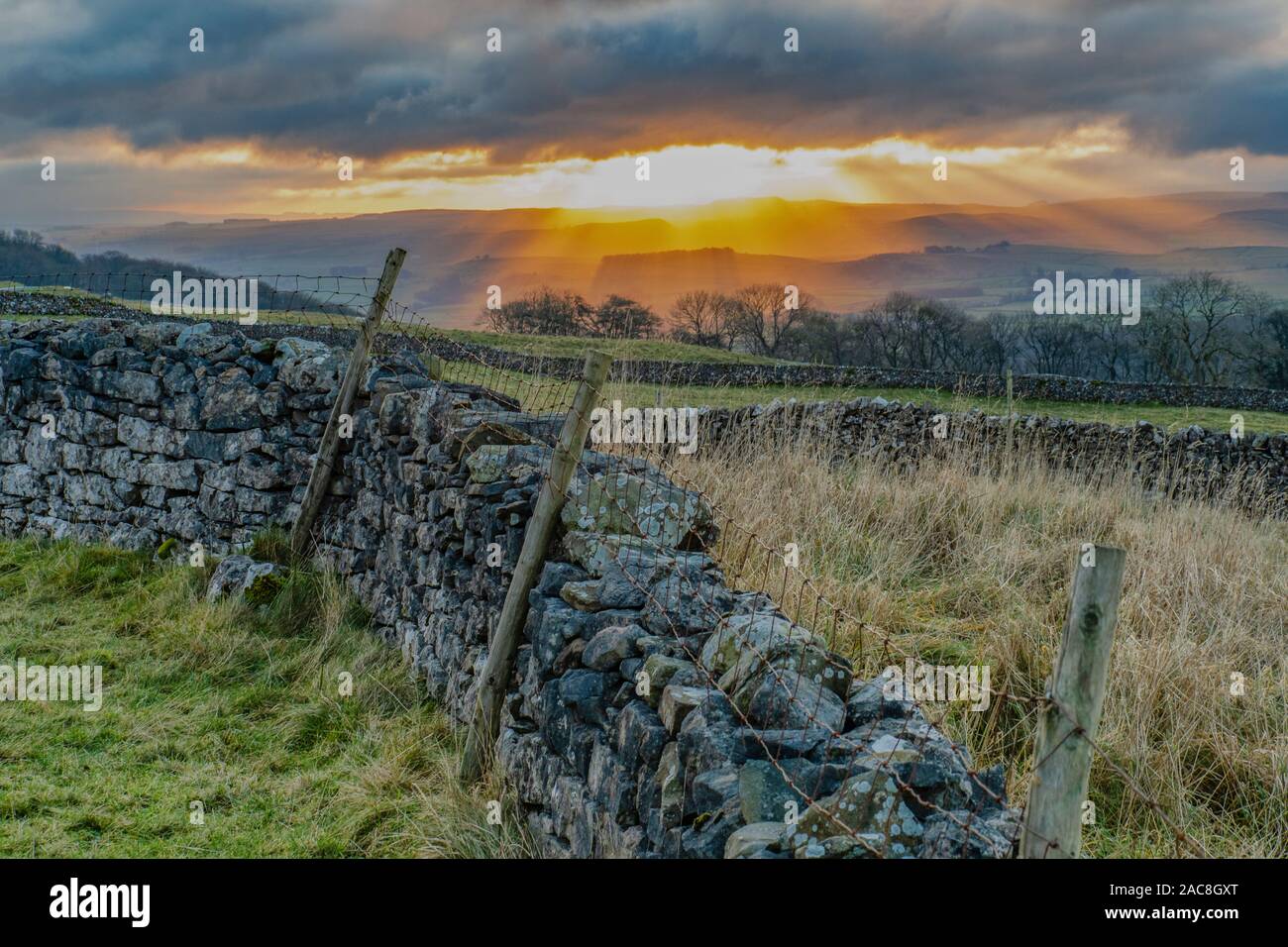 Settle sunset at Winskill Stones near Langcliffe in the Yorkshire Dales ...