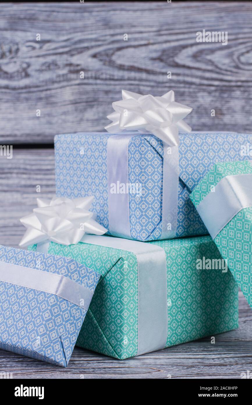 Pile of gift boxes on wooden background Stock Photo - Alamy