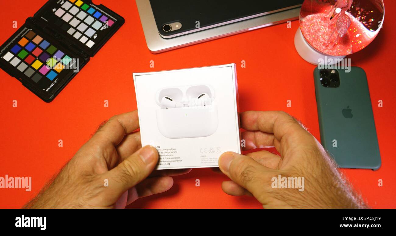 Paris, France - Oct 30, 2019: Overhead view of male hands unboxing new ...