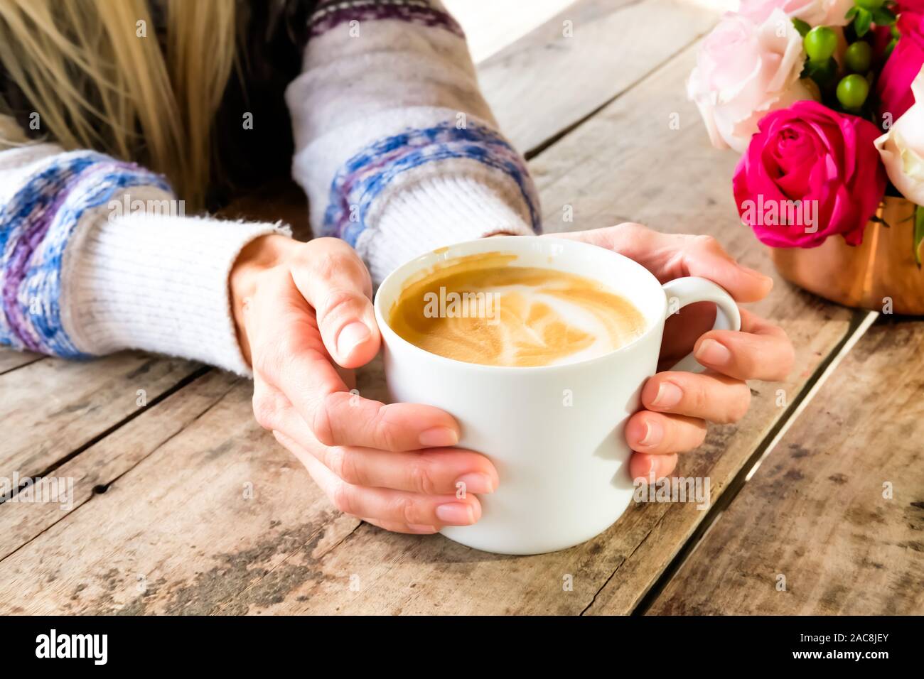 Cup of coffee in hands Stock Photo - Alamy