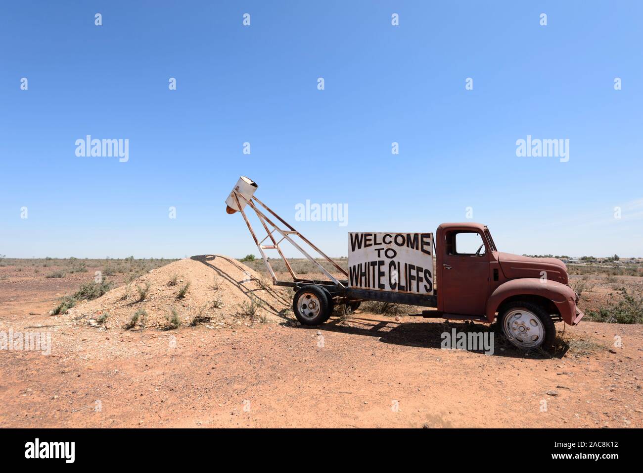 Welcome to White Cliffs sign on an old rusty utility truck or ute, New ...