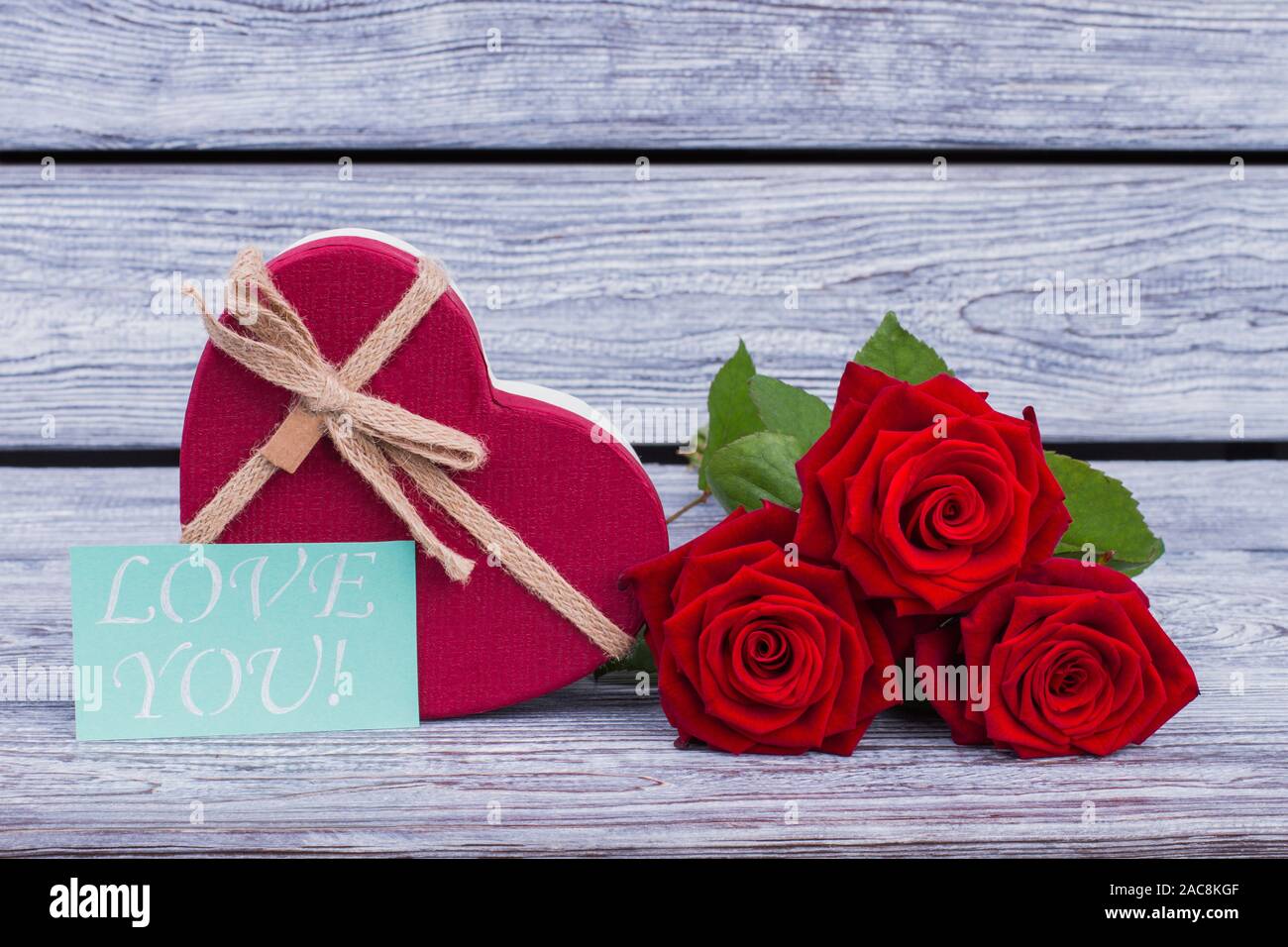 Heart shaped gift box and red roses Stock Photo - Alamy