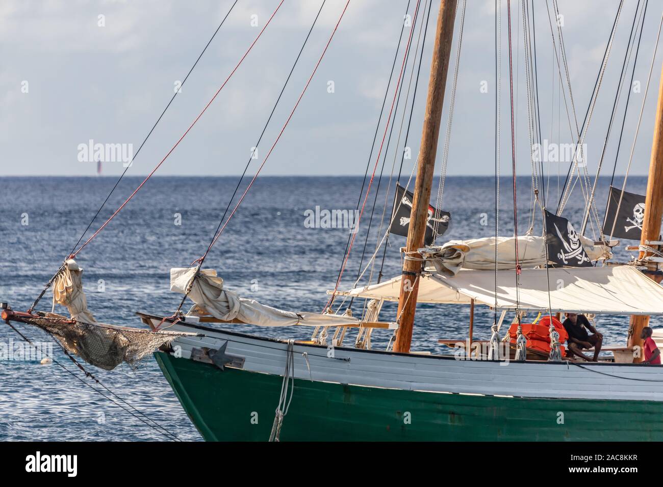 Saint Vincent and the Grenadines, Sailboat ketch with pirate flags ...